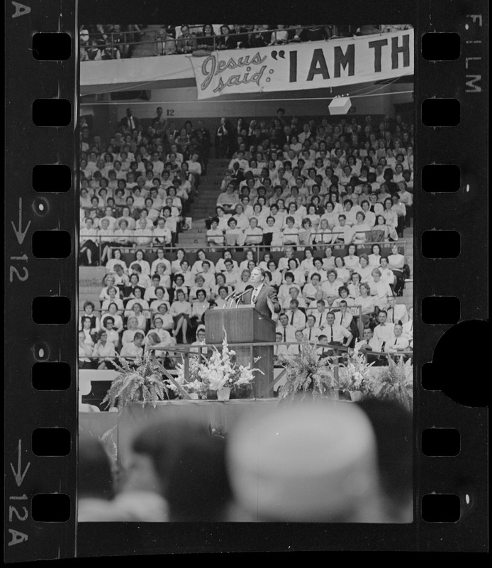 Billy Graham at Boston Garden with crowd in background and foreground ...