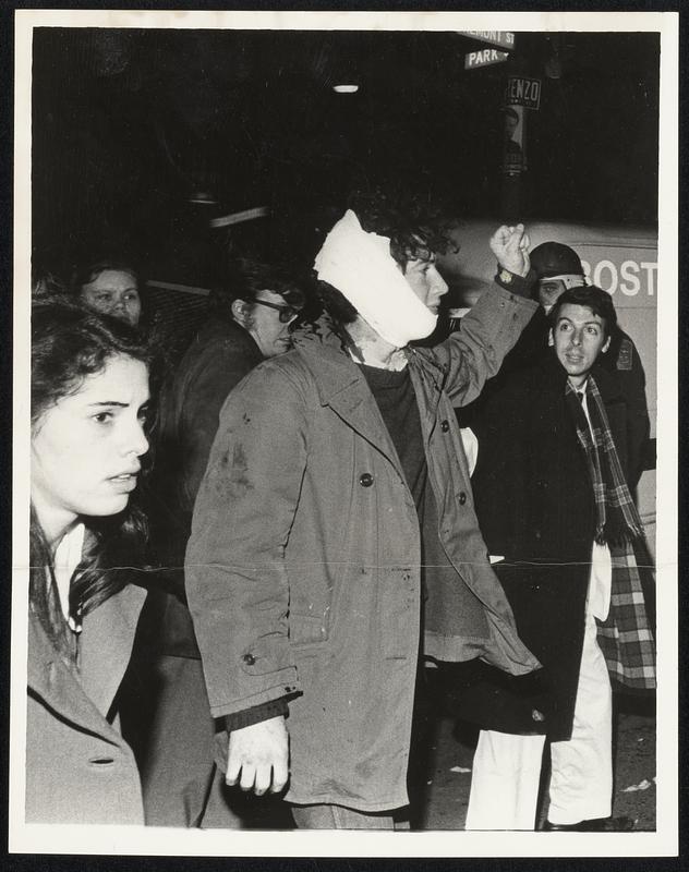 Injured youth raises fist in defiance of Police - Digital Commonwealth