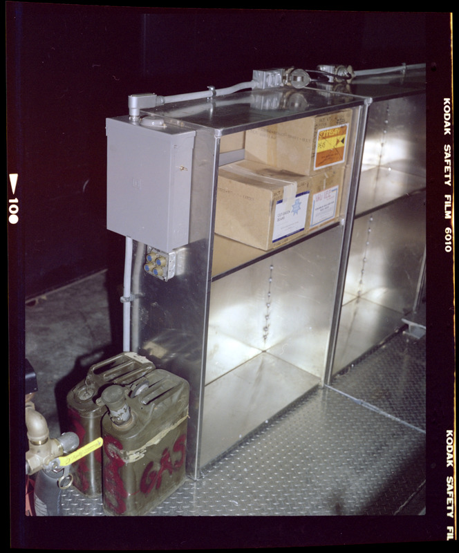 Metal shelving and gas cans - Digital Commonwealth