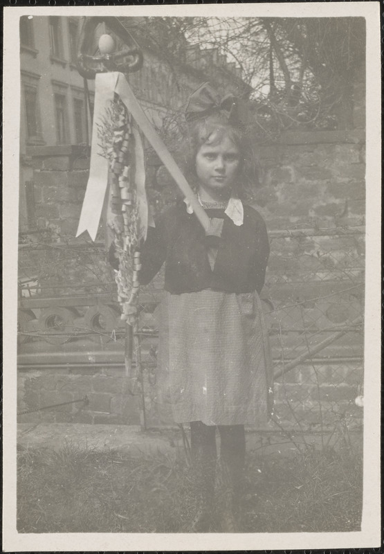 "Helma," daughter of Dr. Fischer, with the pretzel and egg banner she ...