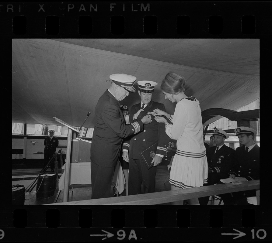 Rear Adm. Joseph Wylie presents medal to Lt. Richard Pearsall aboard ...