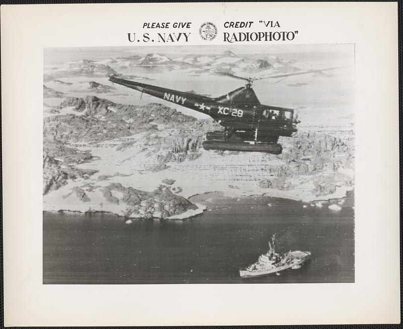 Helicopter from USS Edisto hovering over Station 13 off un-named area ...