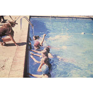 Children waiting for instructor in outdoor pool - Digital Commonwealth