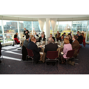 Guests listening to Northeastern President Richard Freeland, standing ...