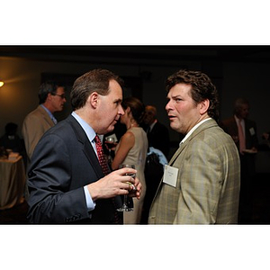 David Camiel and a guest speaking at NU Night at the Pops - Digital ...