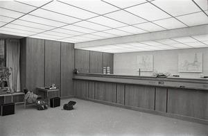 Empty bank with cases for film equipment against a wall - Digital ...