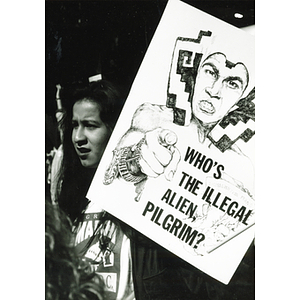 Protest sign and demonstrator at the 1996 Latino and Immigrants' Rights ...