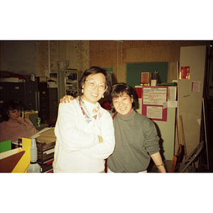 Two women stand smiling - Digital Commonwealth