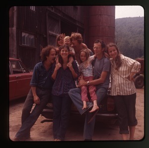 Montague farmers seated on the rear of car outside the barn, Montague ...