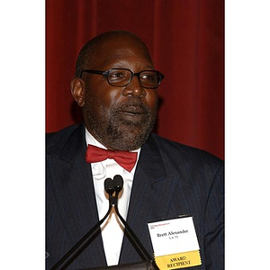 Outstanding Alumni Award recipient Brett Alexander speaks at the Alumni ...