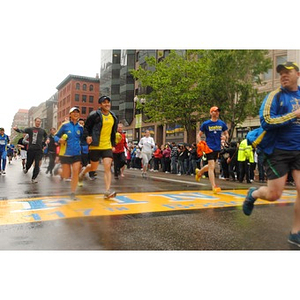 Runners crossing finish line at "One Run" event in Boston (May 2013 ...