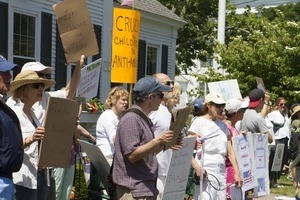 Pro-immigration protesters holding up signs in front of the Chatham ...