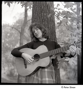Lucy Simon playing guitar and singing - Digital Commonwealth
