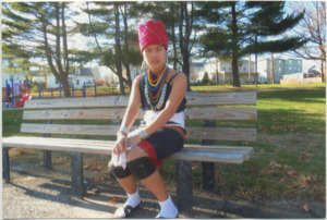 A photograph of Su Meh in traditional Karenni clothing in Lowell ...