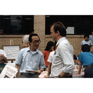 Two men discuss the Long Guang Huang assault case against the Boston ...