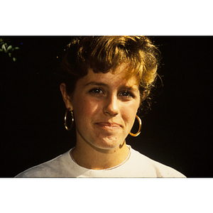 Teen in white with hoop earrings smiling - Digital Commonwealth