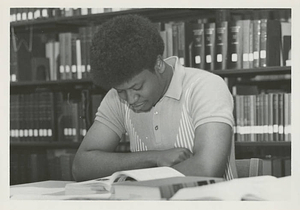 A young man studying in Babson Library - Digital Commonwealth