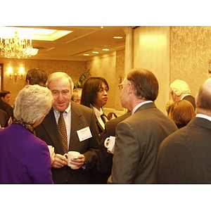 Group talking at the College of Business Administration's CEO Breakfast ...