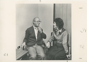 A speech therapist teaches a patients how to use an electrolarynx ...