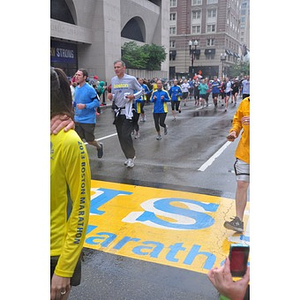 Runners wearing Boston Marathon apparel reach One Run finish line ...