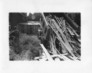 Tony Mathews overseeing a delivery of slabwood, Montague Farm Commune ...