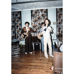 Three-member band performs at a Chinese Progressive Association event ...