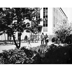 A family walking near Ell Hall, now Curry Student Center - Digital ...