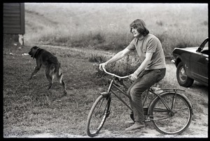 Whit Garberson riding a bicycle, Montague Farm commune - Digital ...