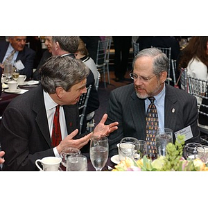 Richard Freeland speaks with another man at The National Council Dinner ...