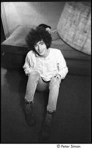 Tim Buckley at the Catacombs: Buckley backstage, seated on the floor ...