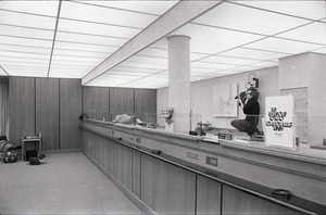 Man filming in empty bank - Digital Commonwealth