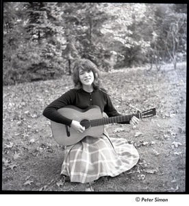 Lucy Simon playing guitar and singing - Digital Commonwealth