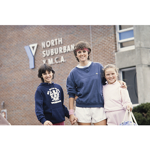 Woman and two children outside North Suburban YMCA - Digital Commonwealth