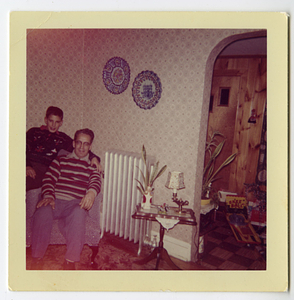 Robert and Tebert Mello, sitting on chair - Digital Commonwealth