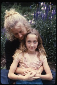 Janice Frey and daughter Sequoya, seated in front of blooming Liatris ...