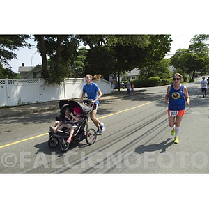 Runner with baby carriage at the StonehamStrong 5K - Digital Commonwealth