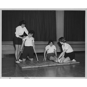 Students give a physical therapy demonstration - Digital Commonwealth