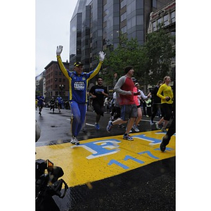 A "One Run" participant wearing the official Boston Marathon bib number ...