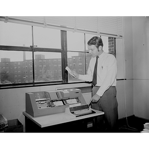 Unidentified man demonstrates new IBM card-punch machine - Digital ...