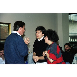 Unidentified male staffer talks to Claudio Ragazzi and unidentified ...