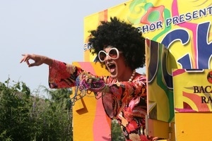 Parader throwing beaded necklaces from a truck : Provincetown Carnival ...