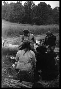 Sitting around a campfire, Montague Farm commune - Digital Commonwealth