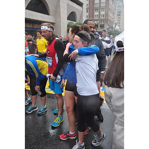 Two women hug after finishing One Run - Digital Commonwealth