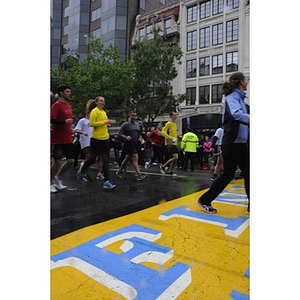 Many "One Run" participants approach the Copley Square finish line ...