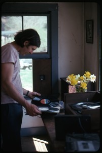 Tony Mathews looking at records, Montague Farm Commune - Digital ...
