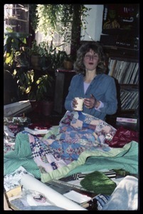 Janice Frey, under quilts (probably on Christmas morning), Montague ...