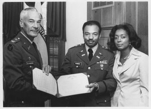 Lt. Col. James Champlain Faison standing indoors with woman and Mr ...