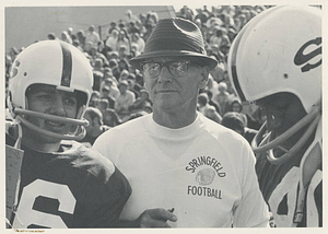Coach Ted Dunn with two football players - Digital Commonwealth