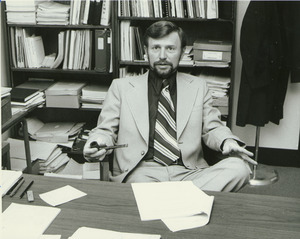Robert L. Chew sitting behind desk in office, holding a pipe - Digital ...