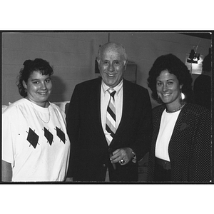 Two women posing with former Boston Celtics Coach Red Auerbach ...